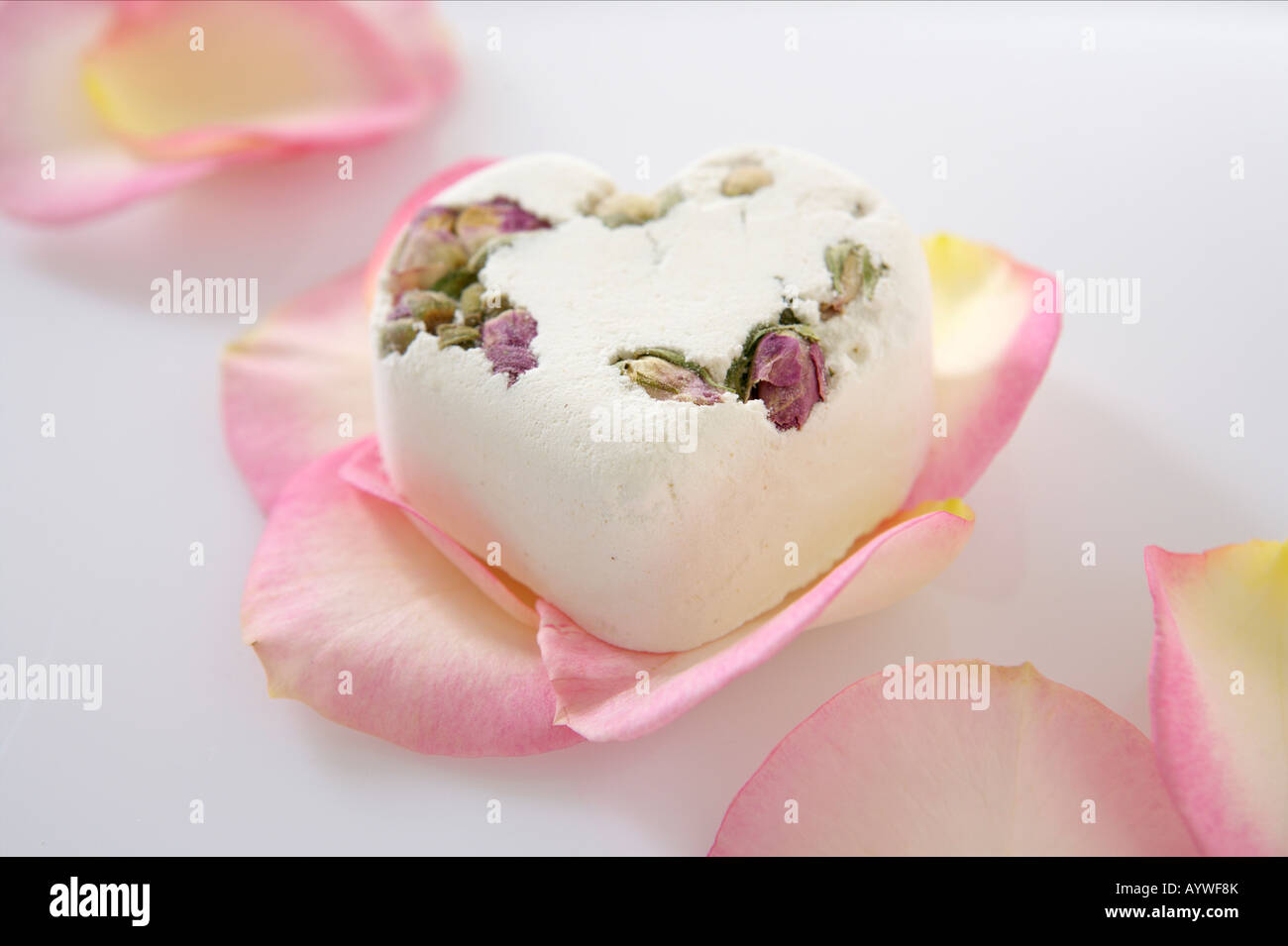A heart-shaped piece of soap on rose petals Stock Photo - Alamy