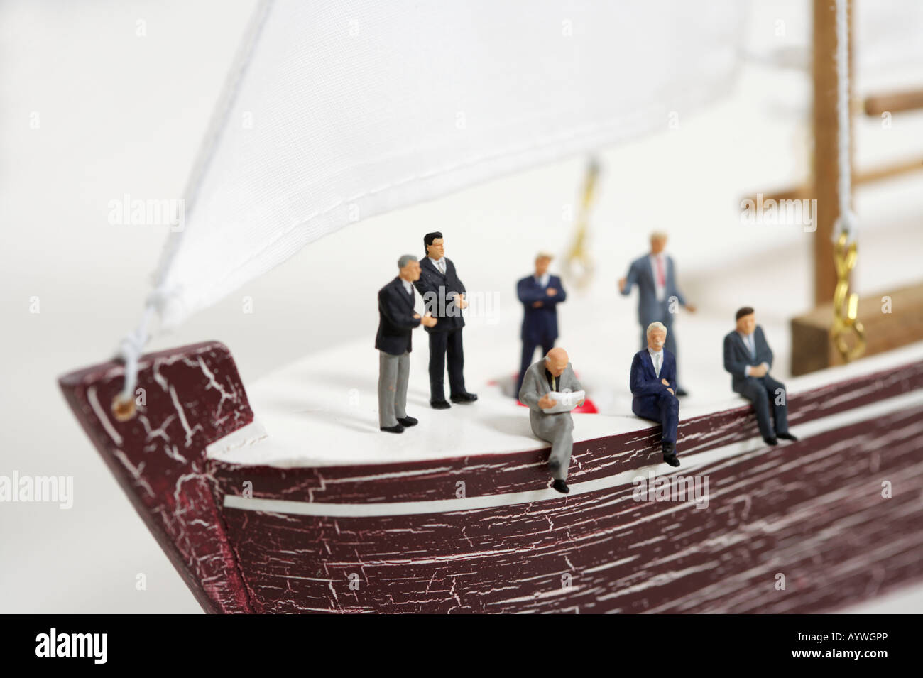 Businessmen figurines on a miniature ship Stock Photo - Alamy