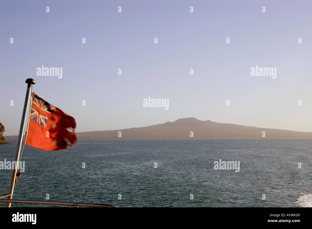 Rangitoto island ships flag red ripped sea water auckland hi-res stock ...