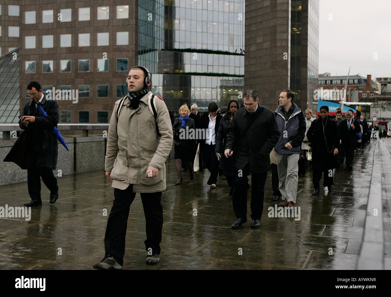 Commuters walk over London Bridge towards the City of London Stock ...
