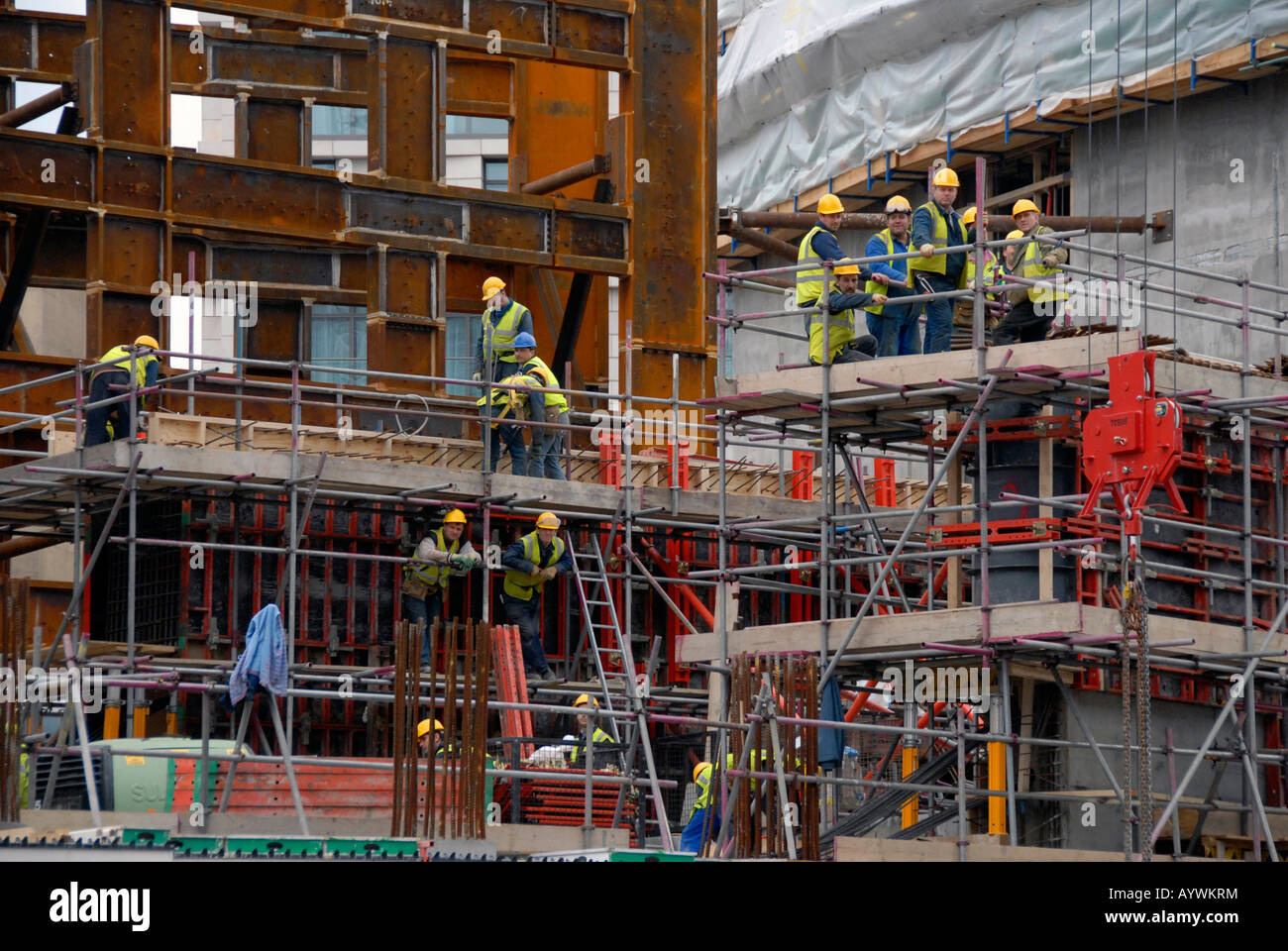 group of workmen on building construction site Stock Photo - Alamy