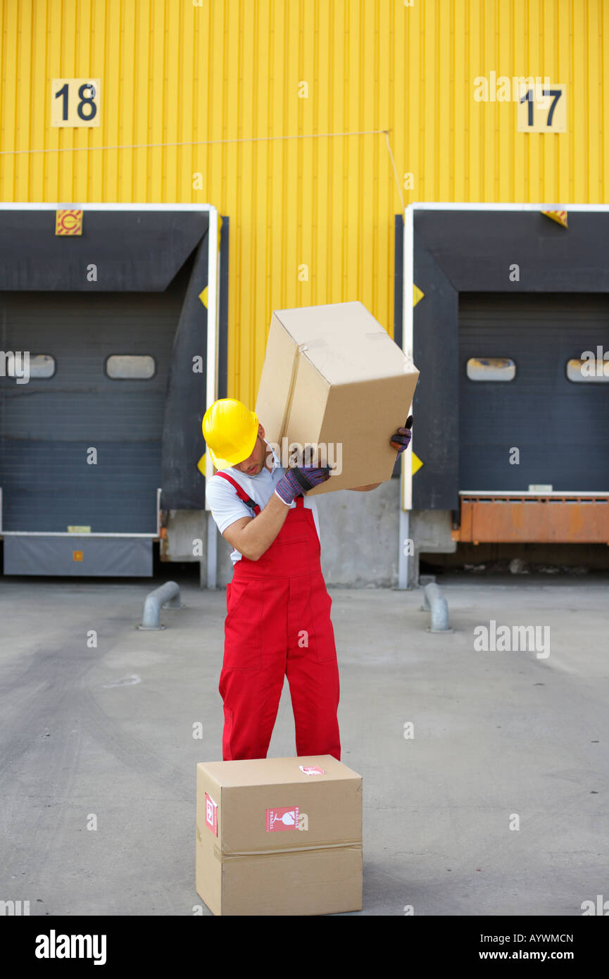 Man carrying a packet Stock Photo - Alamy