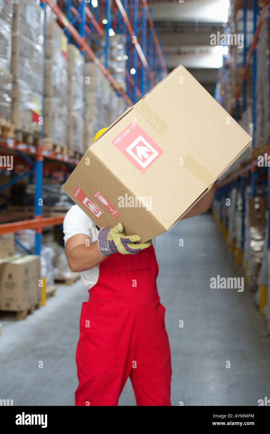 Man carrying a packet Stock Photo - Alamy