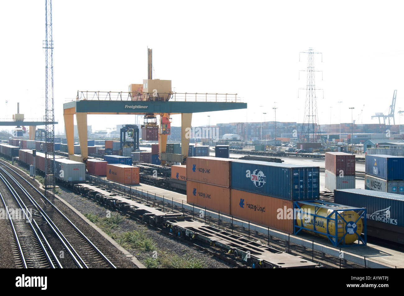 Containers being lifted on to railway carriages at the Freightliner ...
