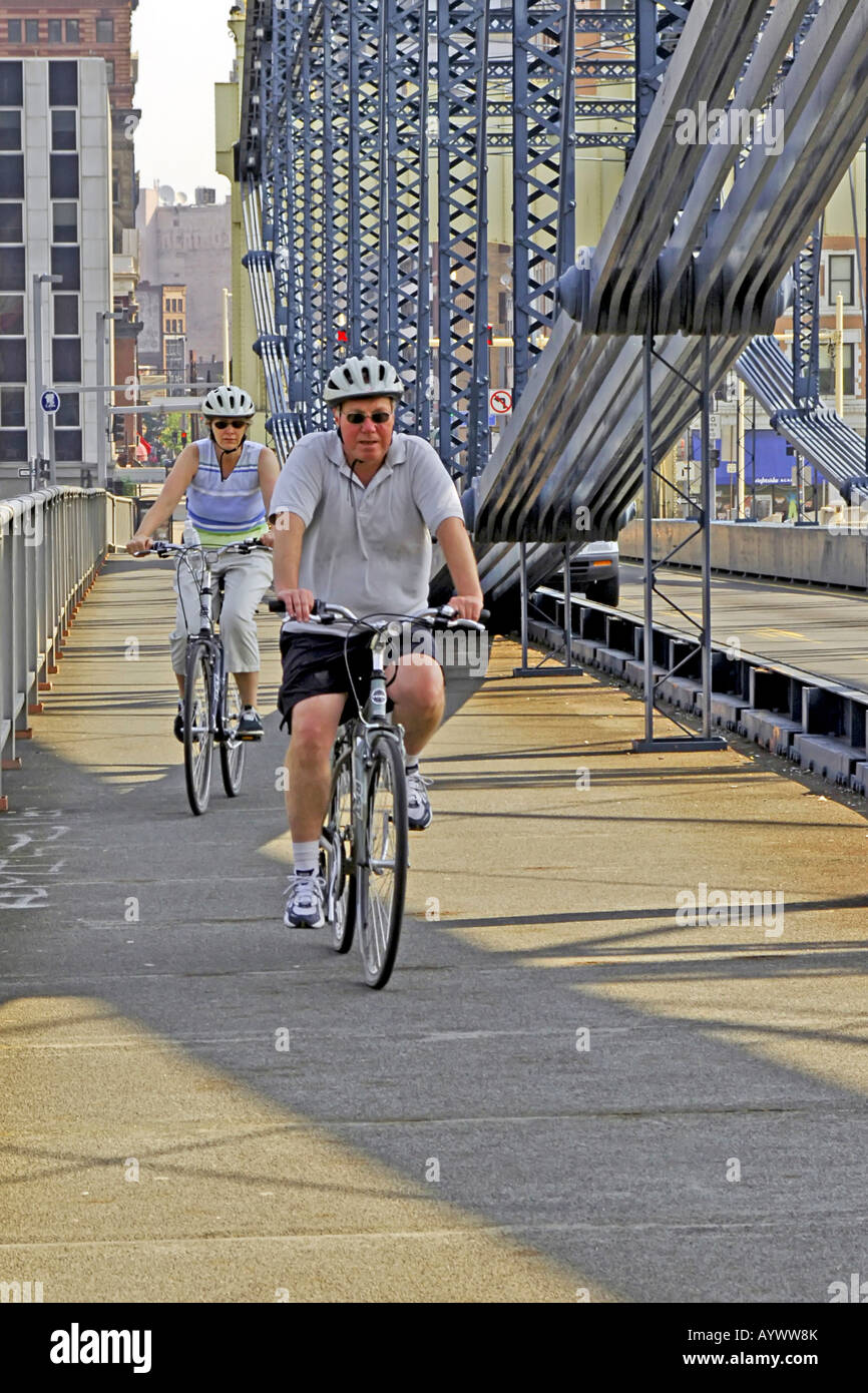 Senior male and female Cyclists in downtown Pittsburgh Pennsylvania ...