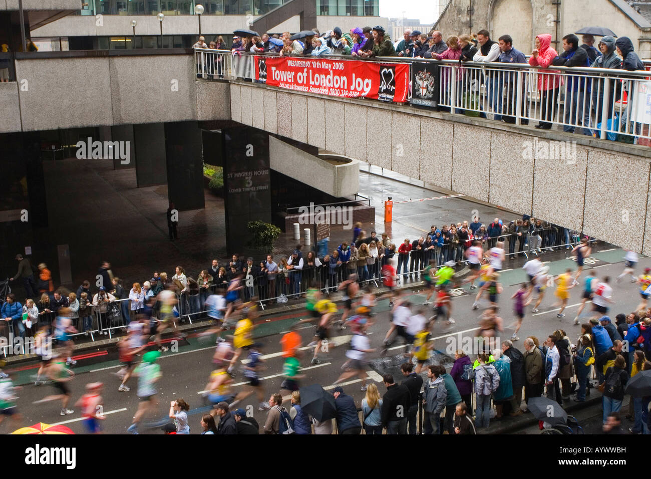 Runners pass under a bridge over Upper Thames Street during the 2006 ...