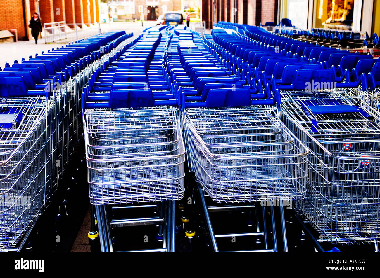 Stacked shopping carts outside supermarket Manchester UK Stock Photo ...