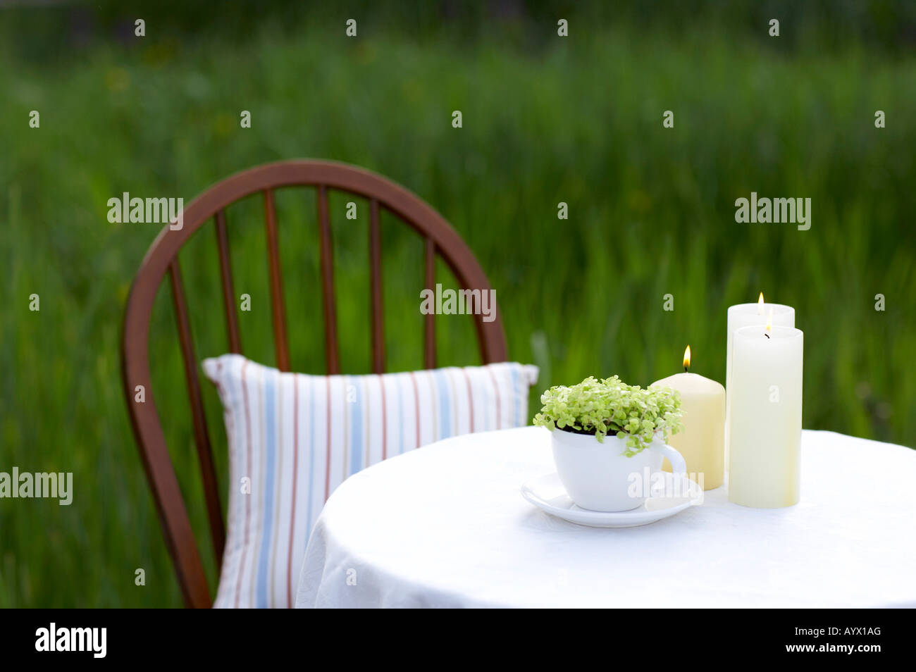 Coffee cup and candle on the table Stock Photo - Alamy