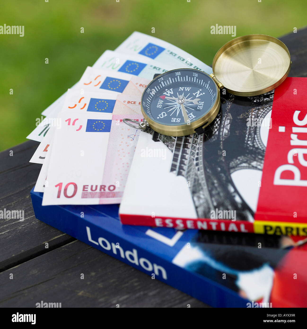 comapss, bill and vacation book Stock Photo - Alamy