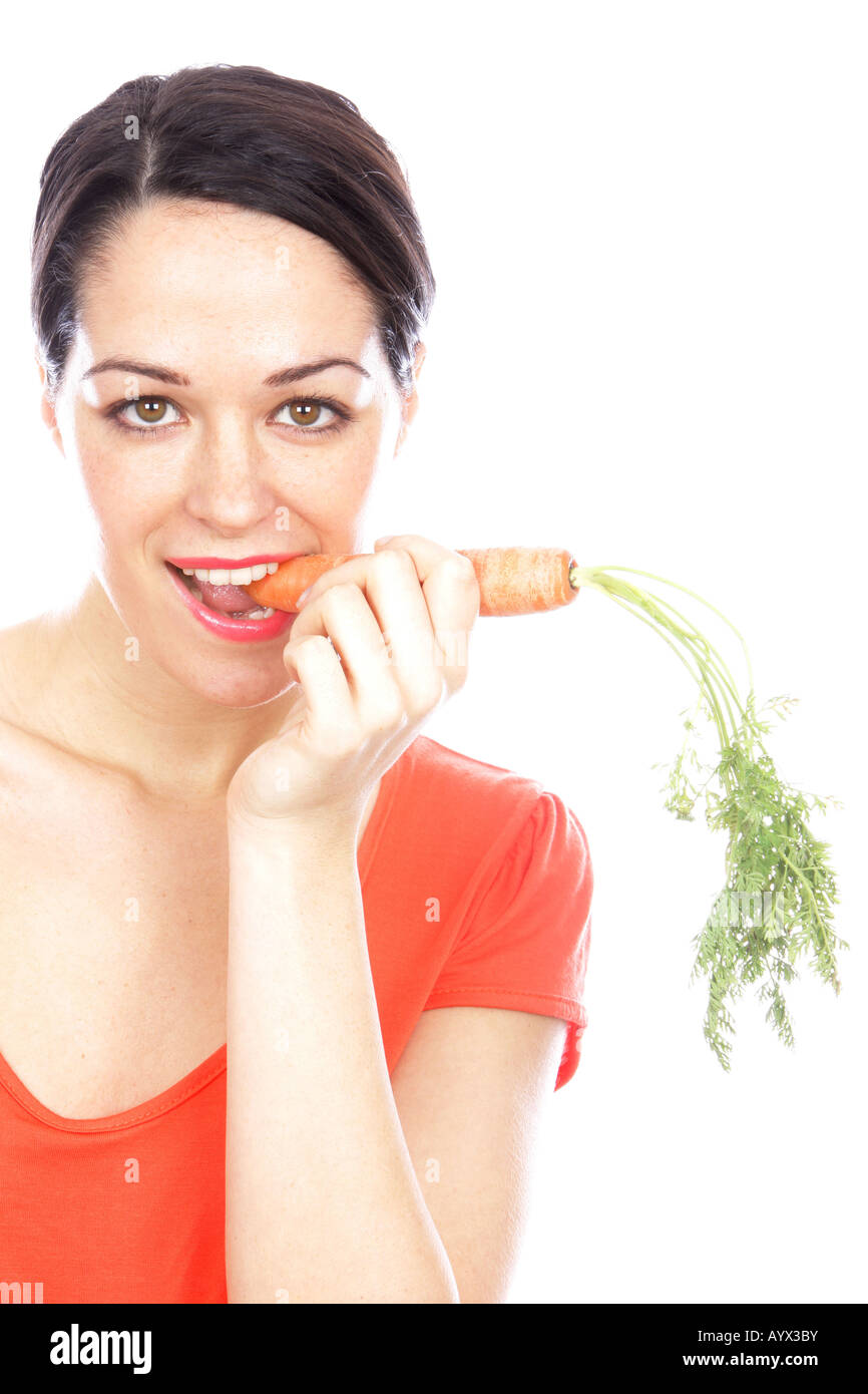 Young Woman Eating Carrot Model Released Stock Photo - Alamy