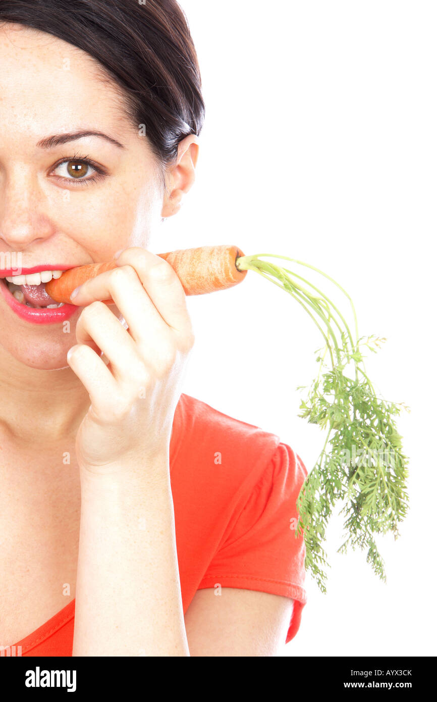 Young Woman Eating Carrot Model Released Stock Photo - Alamy
