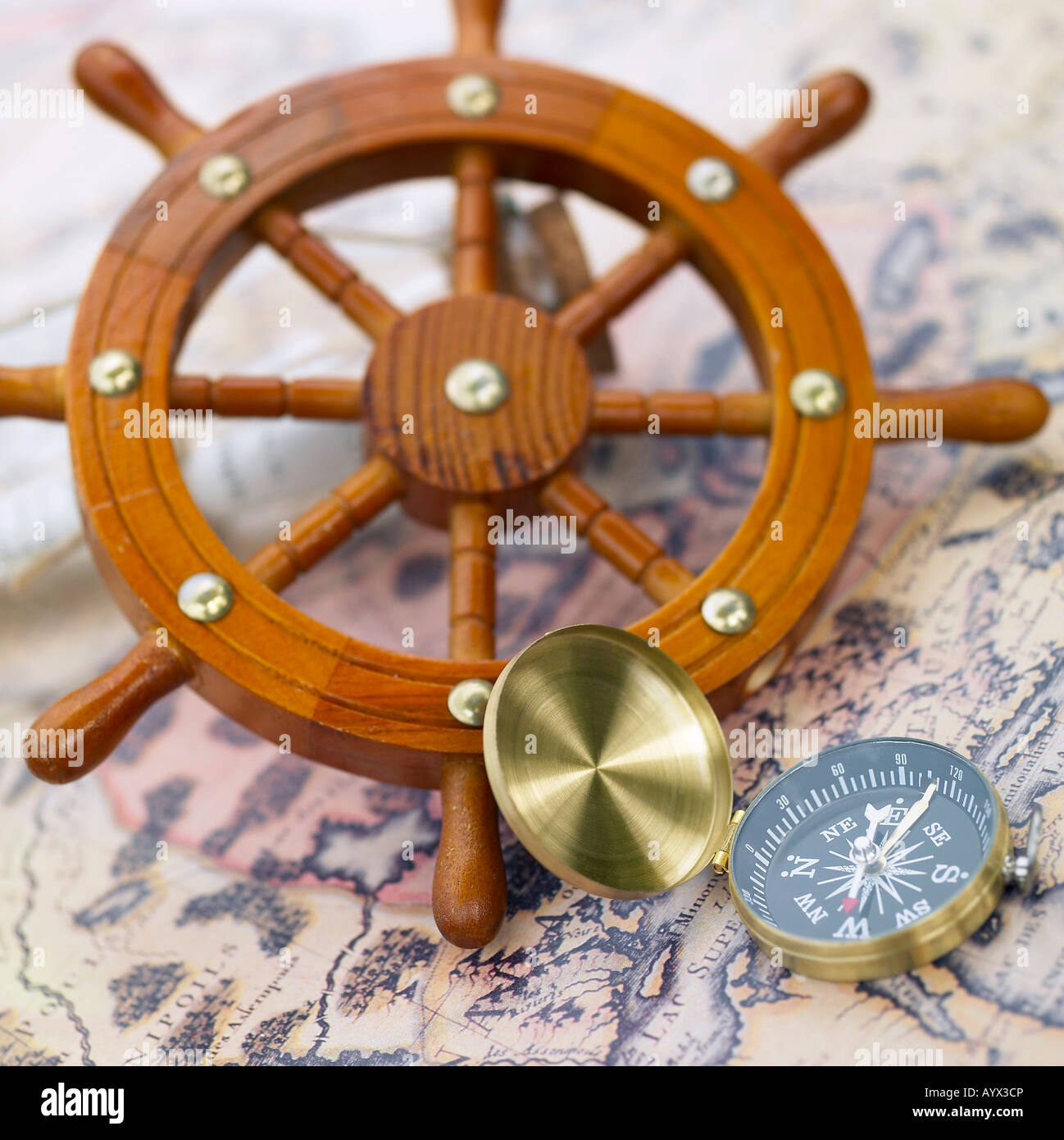 wheel and comapss on the map Stock Photo - Alamy