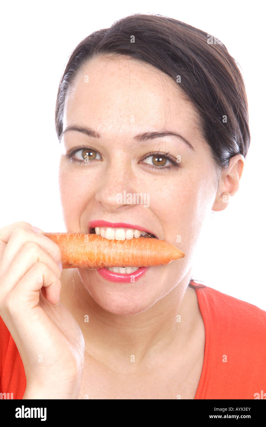 Young Woman Eating Carrot Model Released Stock Photo - Alamy