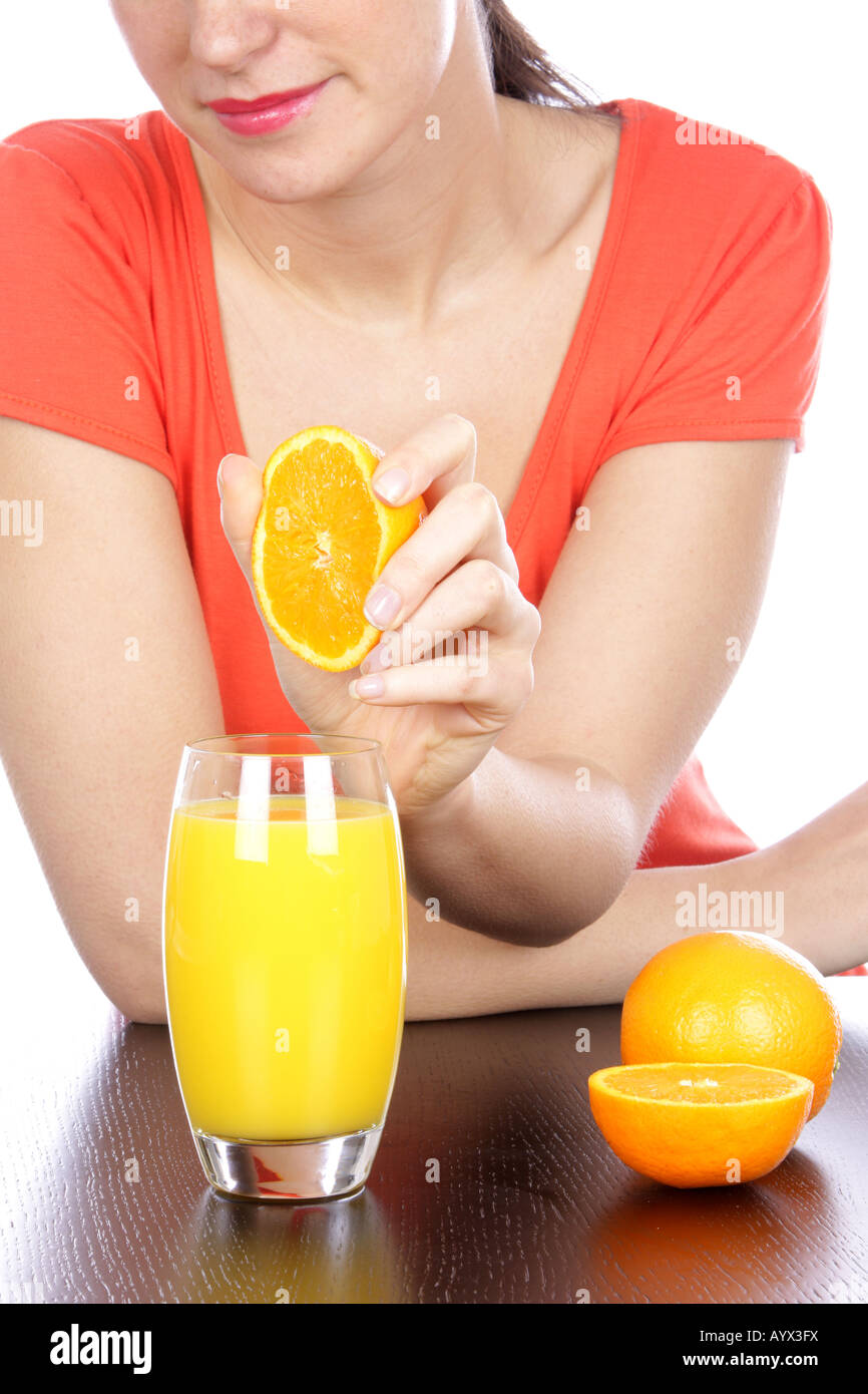 Young Woman Making Orange Juice Model Released Stock Photo - Alamy