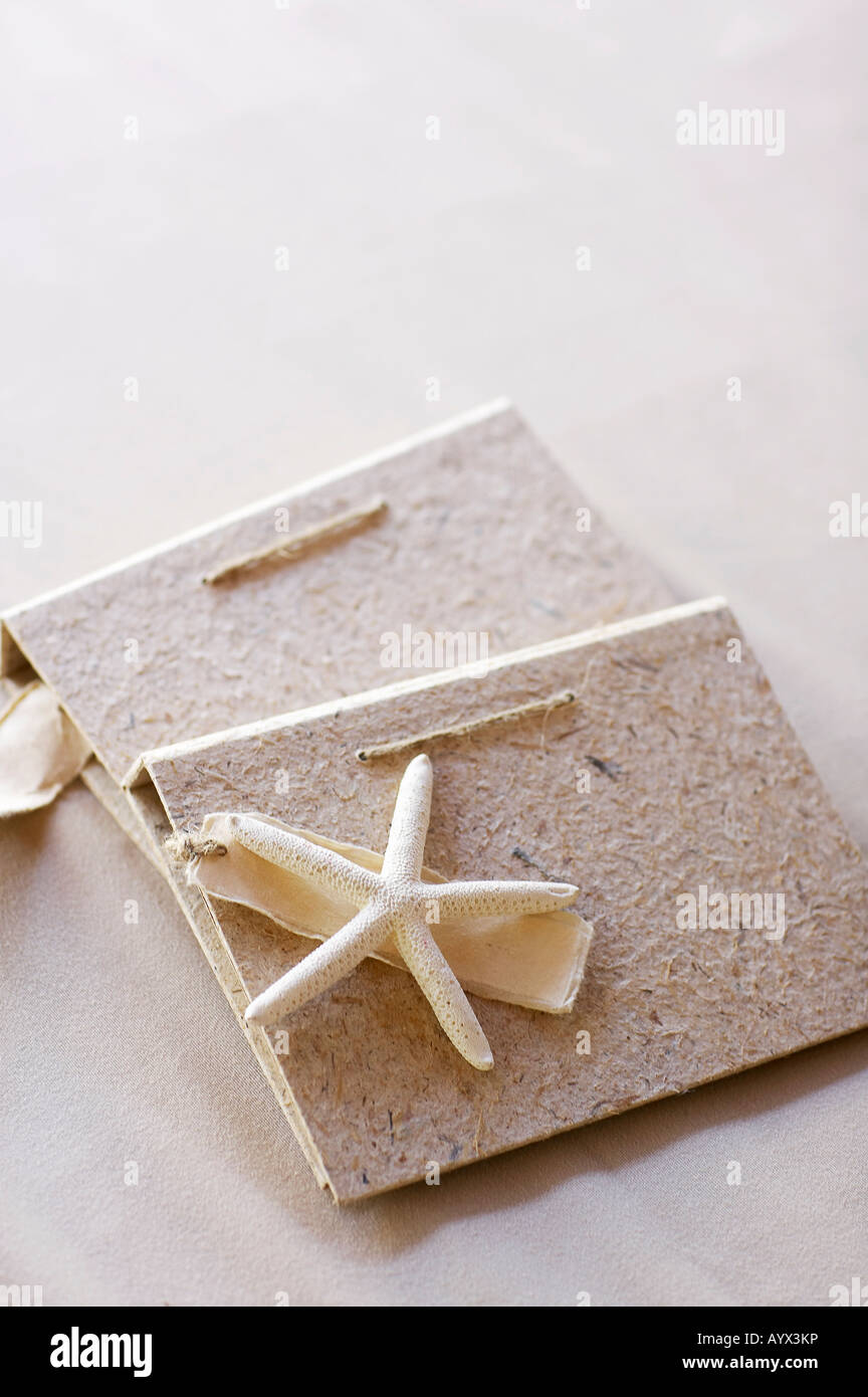 starfish and book with tag Stock Photo - Alamy