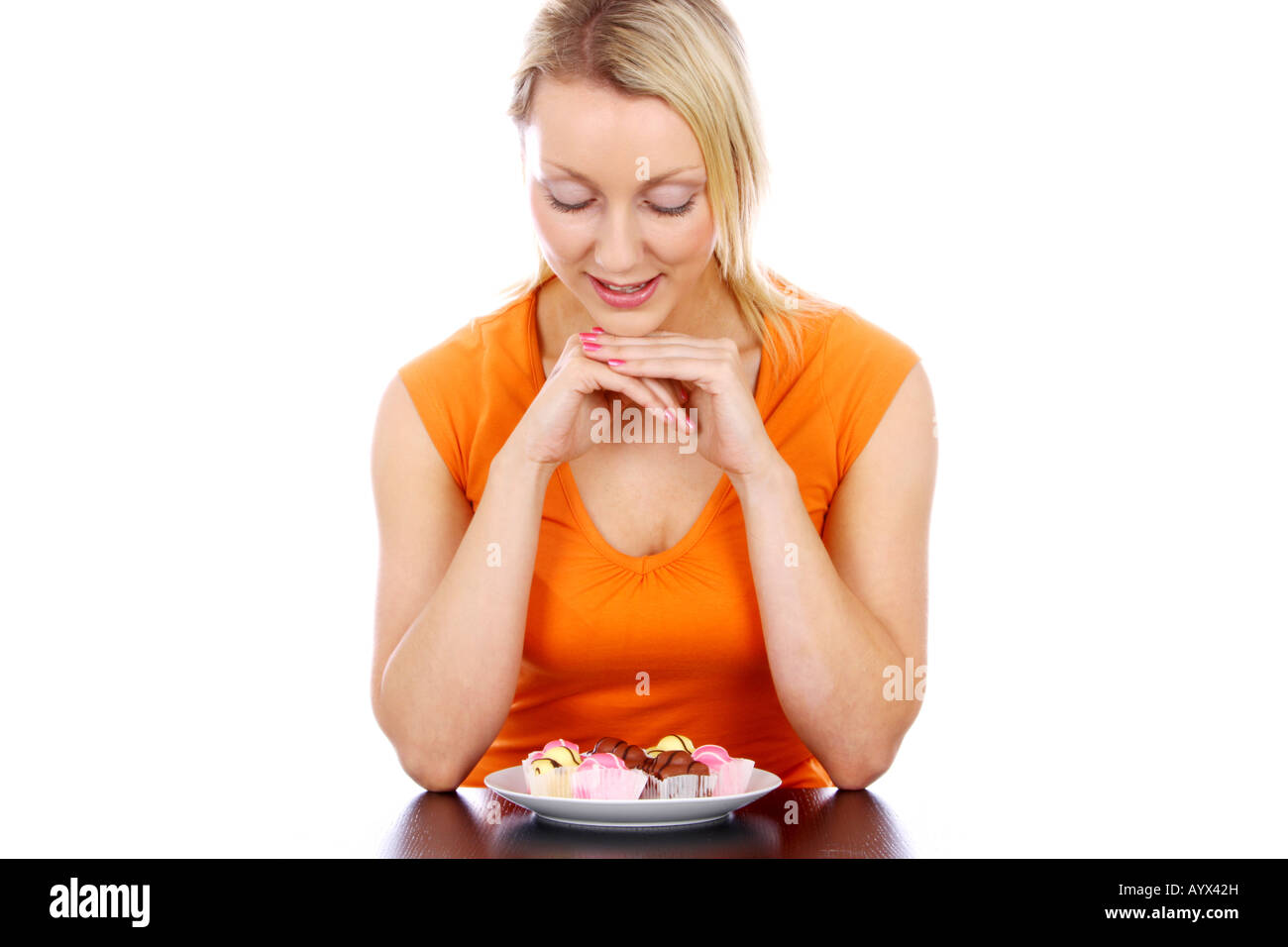 Young Woman Choosing a French Fancy Model Released Stock Photo - Alamy