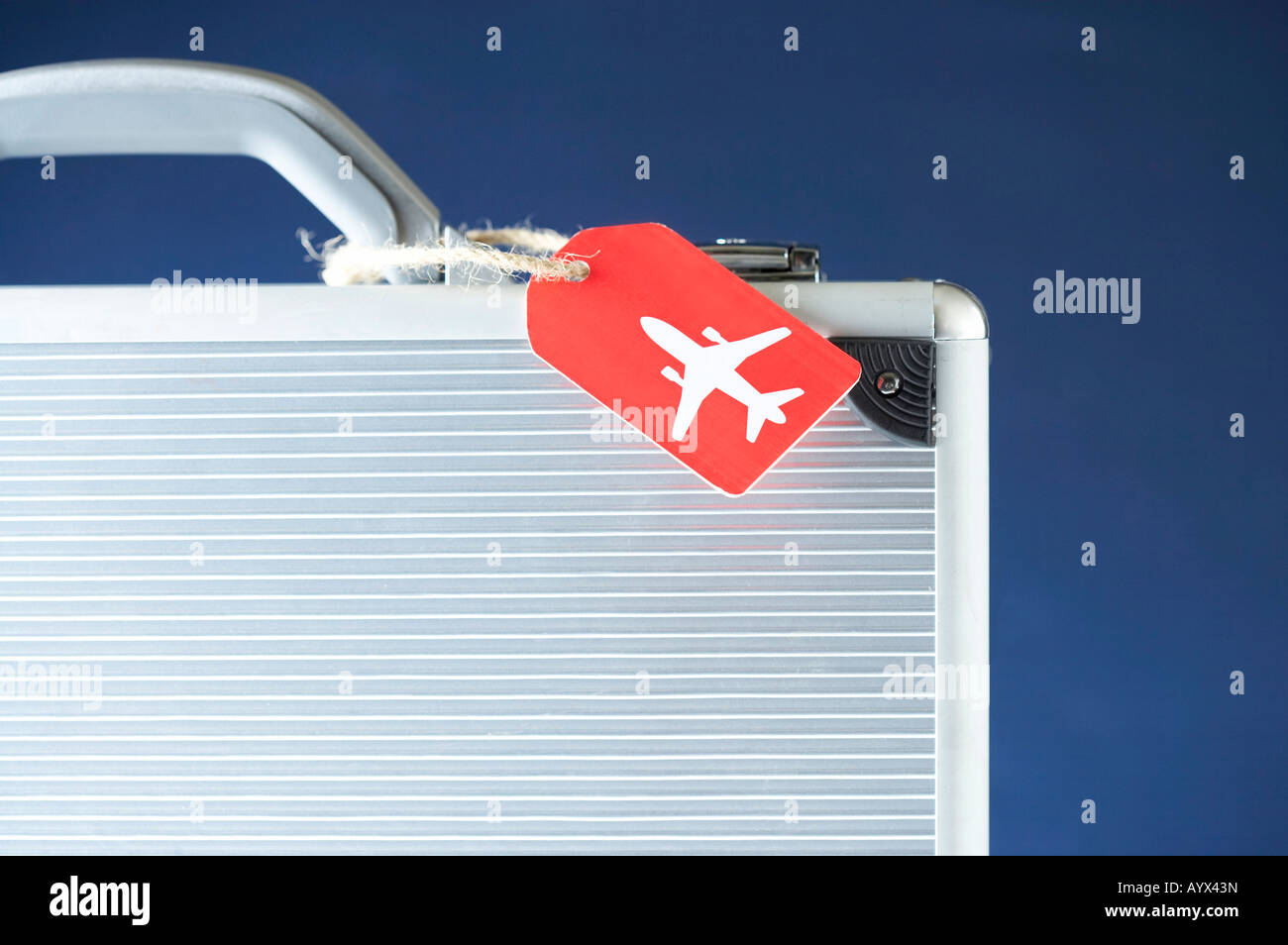 red tag attached metal bag Stock Photo - Alamy