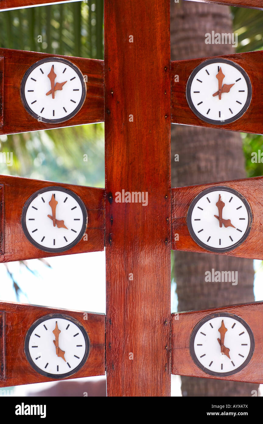 wooden poll with clock Stock Photo - Alamy