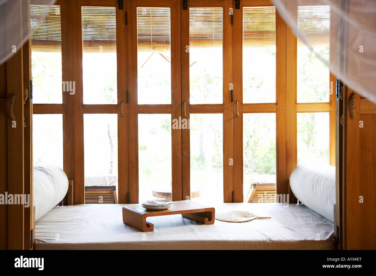 bed next to the window Stock Photo - Alamy