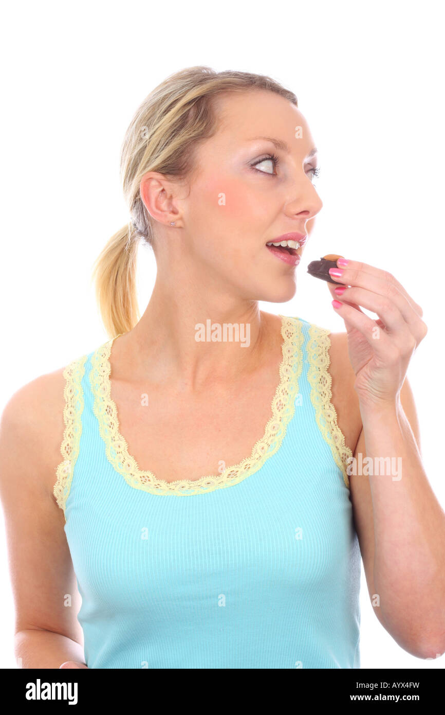 Young Woman Eating Chocolate Model Released Stock Photo - Alamy