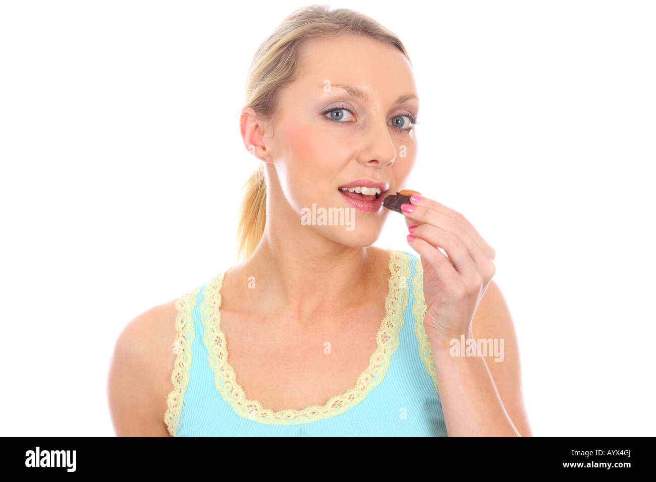 Young Woman Eating Chocolate Model Released Stock Photo - Alamy