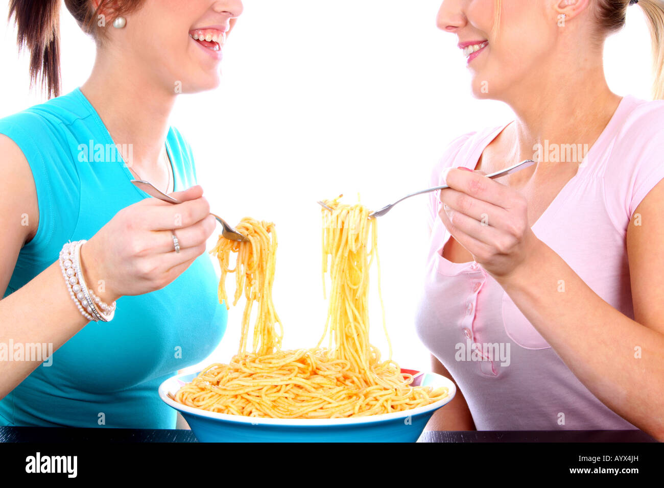 Young Women Eating Spaghetti Model Released Stock Photo - Alamy