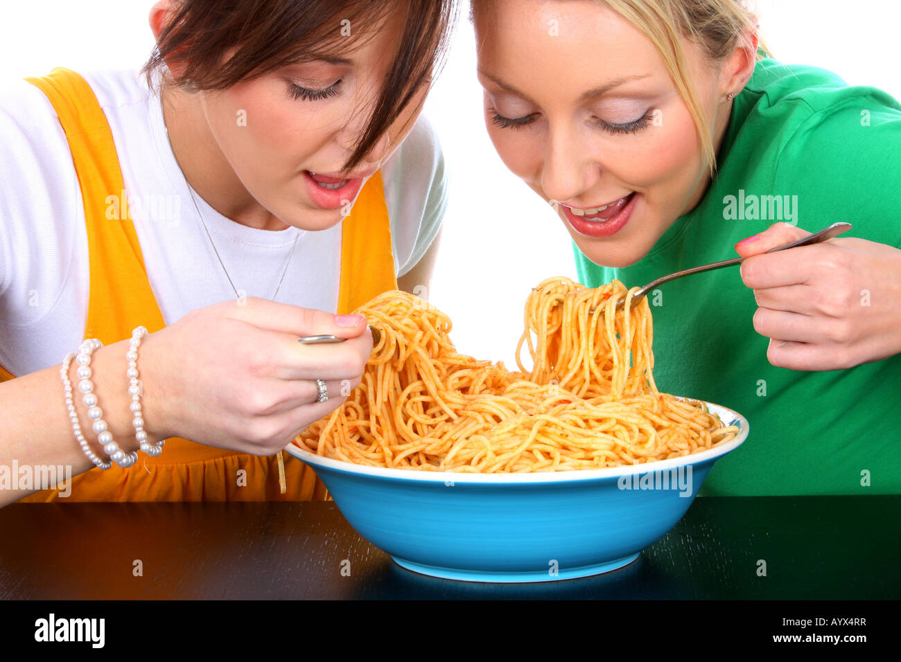 Young woman slurping spaghetti hi-res stock photography and images - Alamy