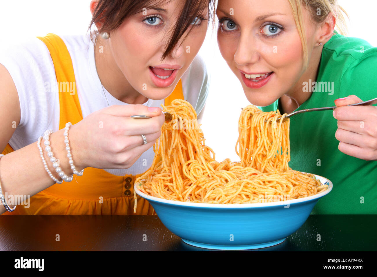 Young Women Eating Spaghetti Model Released Stock Photo - Alamy