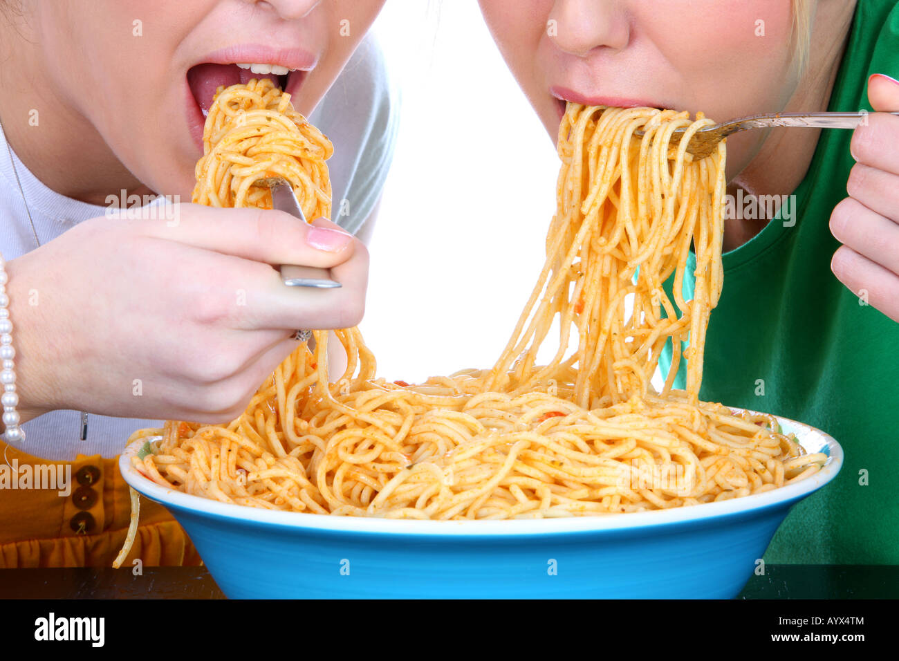 Young Women Eating Spaghetti Model Released Stock Photo - Alamy