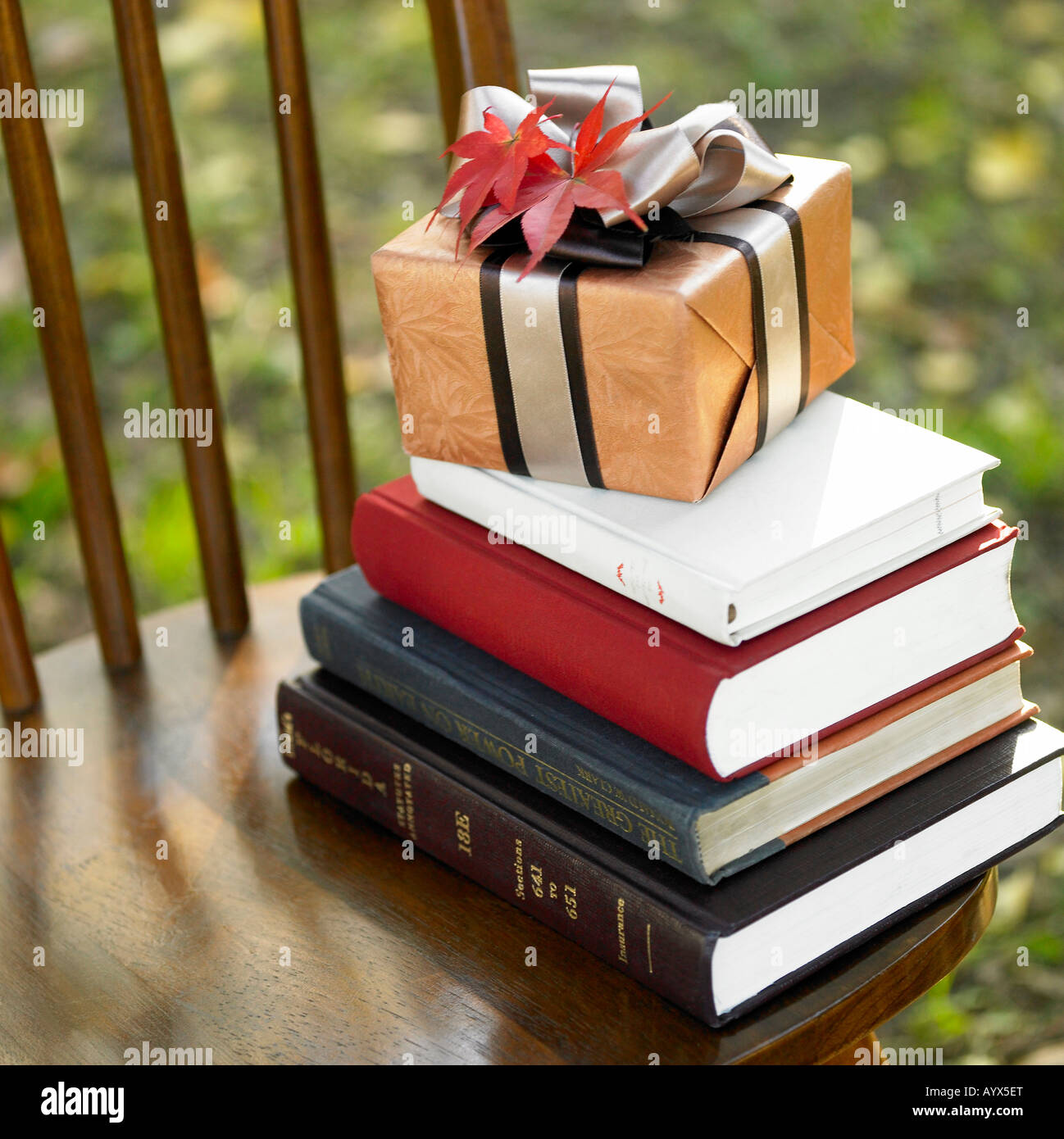 book and gift set on the chair Stock Photo - Alamy