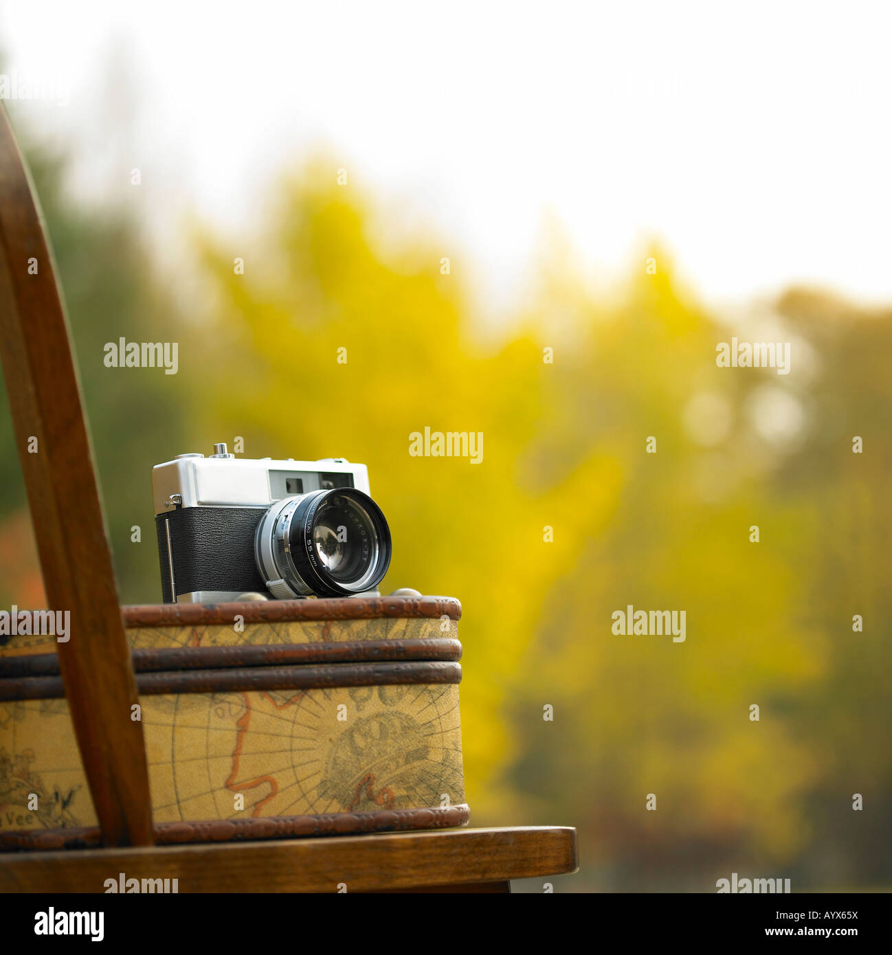 bag and camera on the chair Stock Photo - Alamy