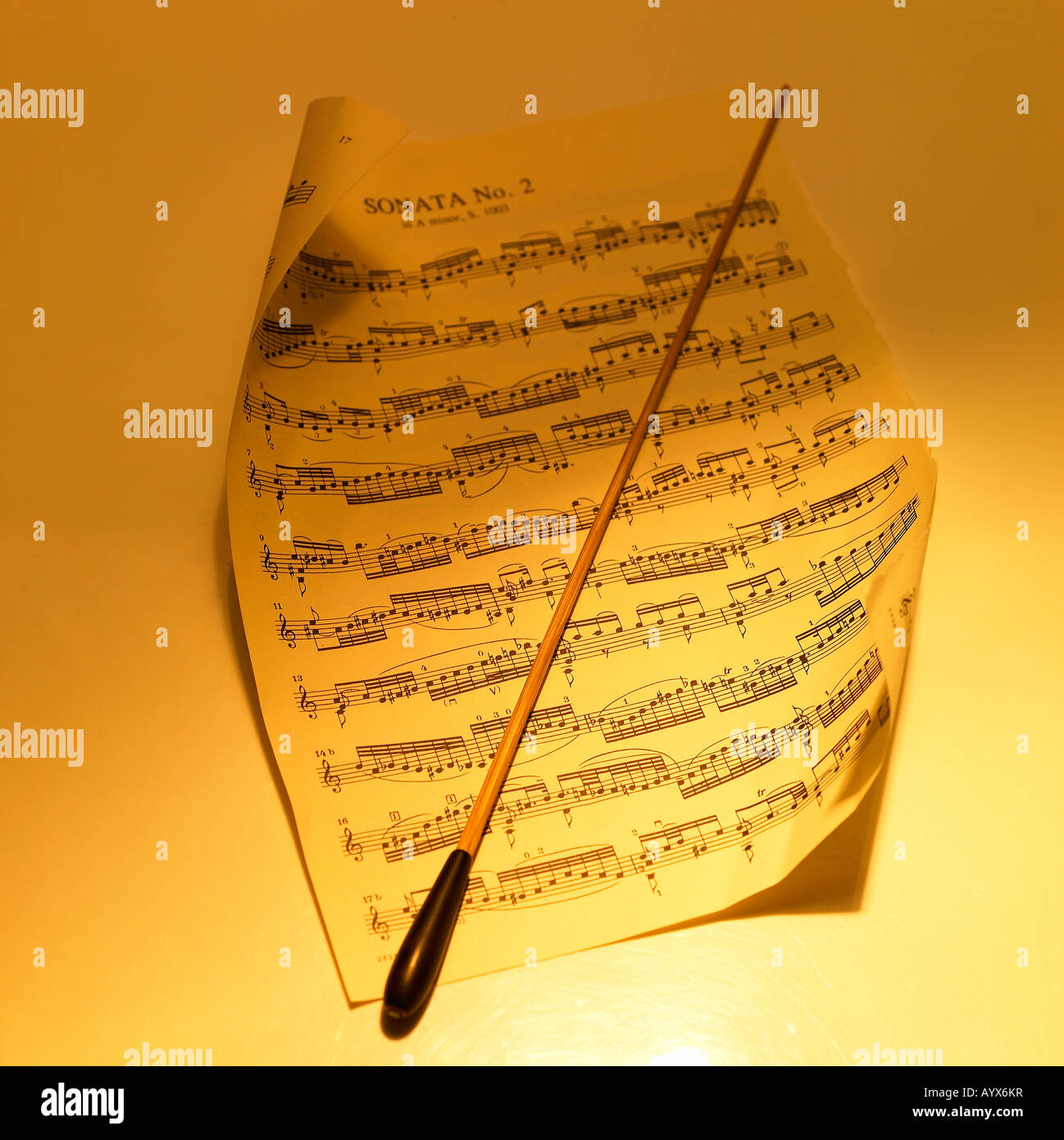 baton on the musical score Stock Photo - Alamy