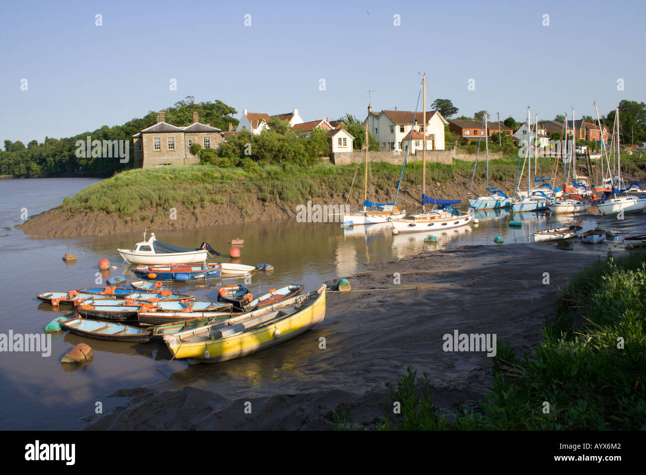 Small Boats in a Muddy River Inlet Stock Photo - Alamy
