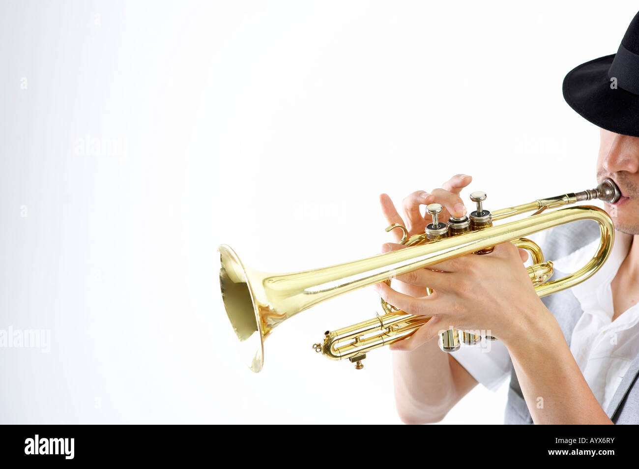 Blowing trumpet hi-res stock photography and images - Alamy