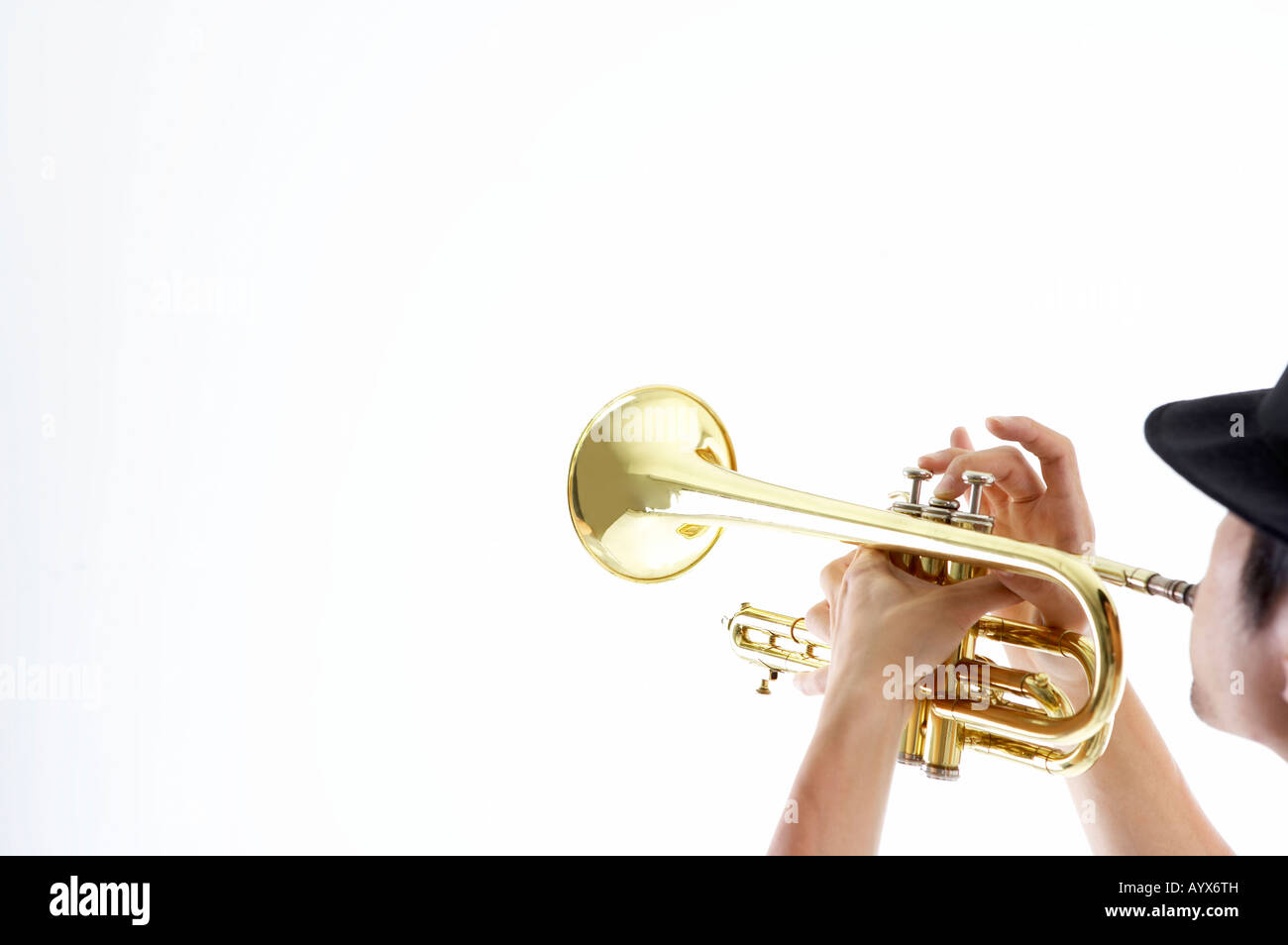 Man blowing into trumpet hi-res stock photography and images - Alamy