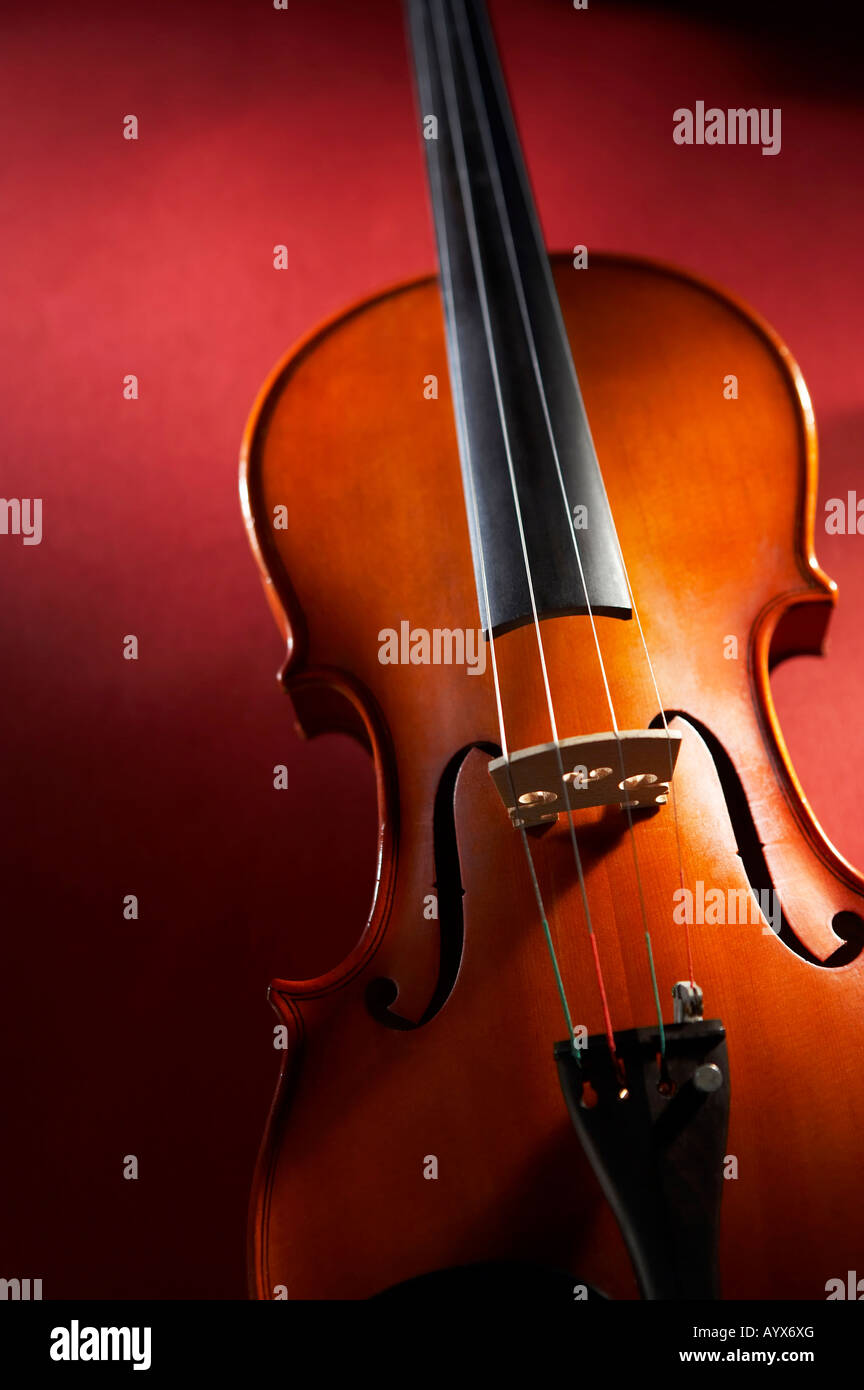 violin with red background Stock Photo - Alamy