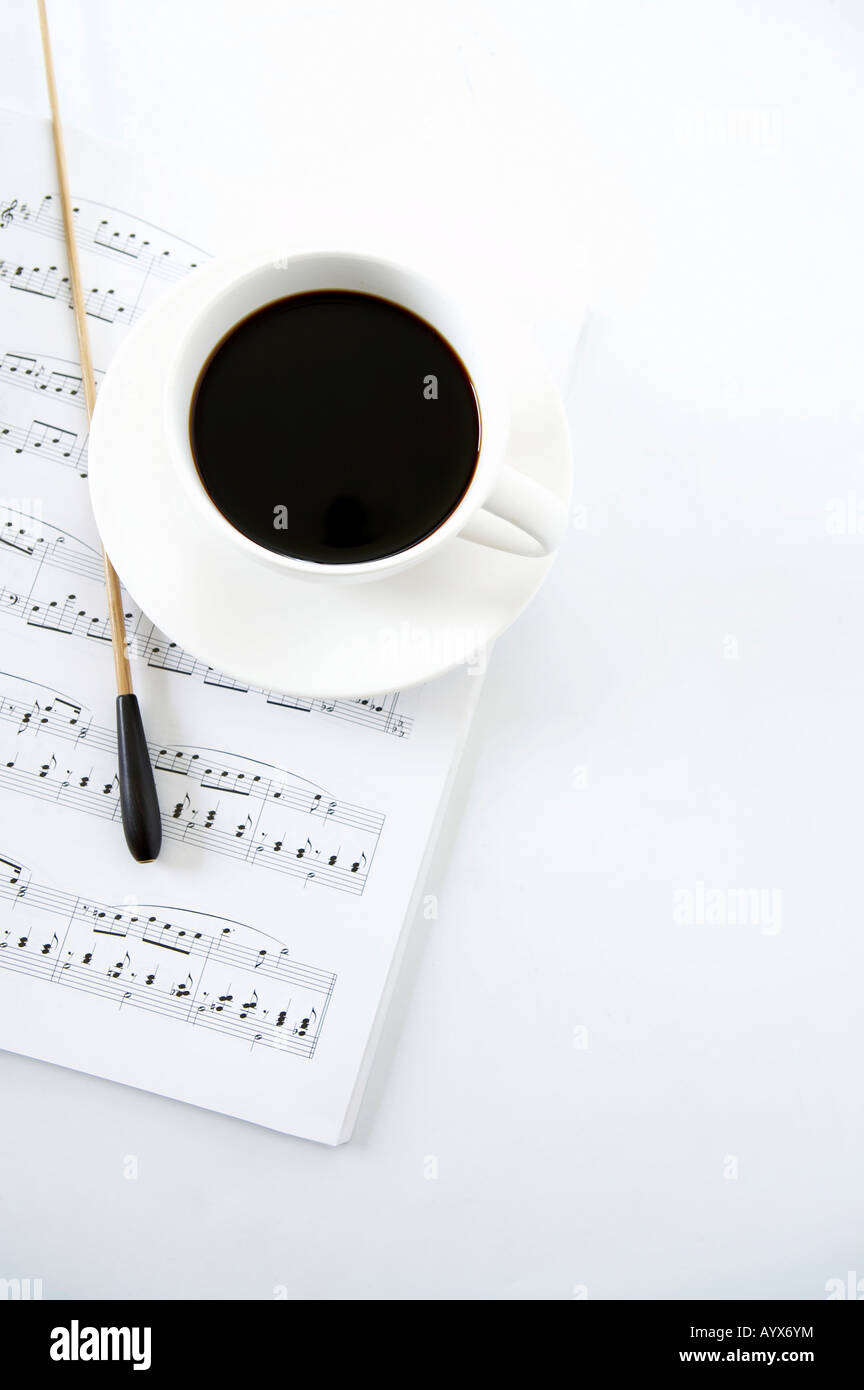 music book and coffee cup on white background Stock Photo - Alamy
