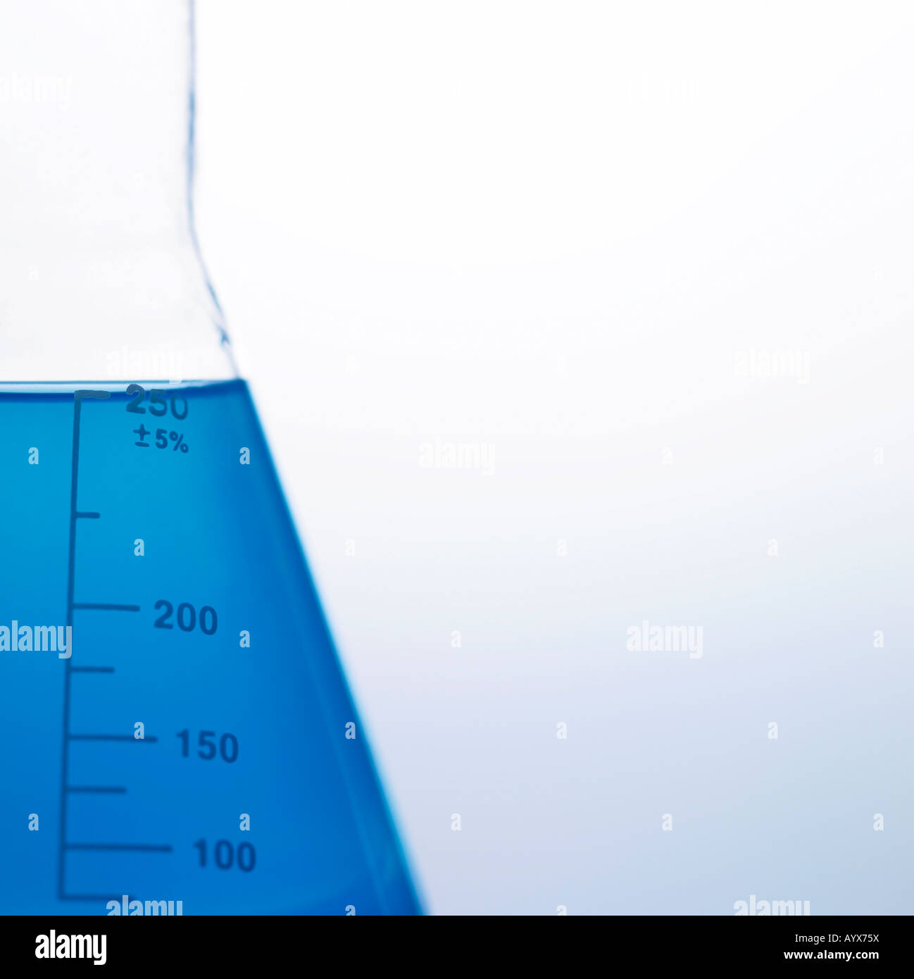 triangular flask with blue fluid Stock Photo - Alamy