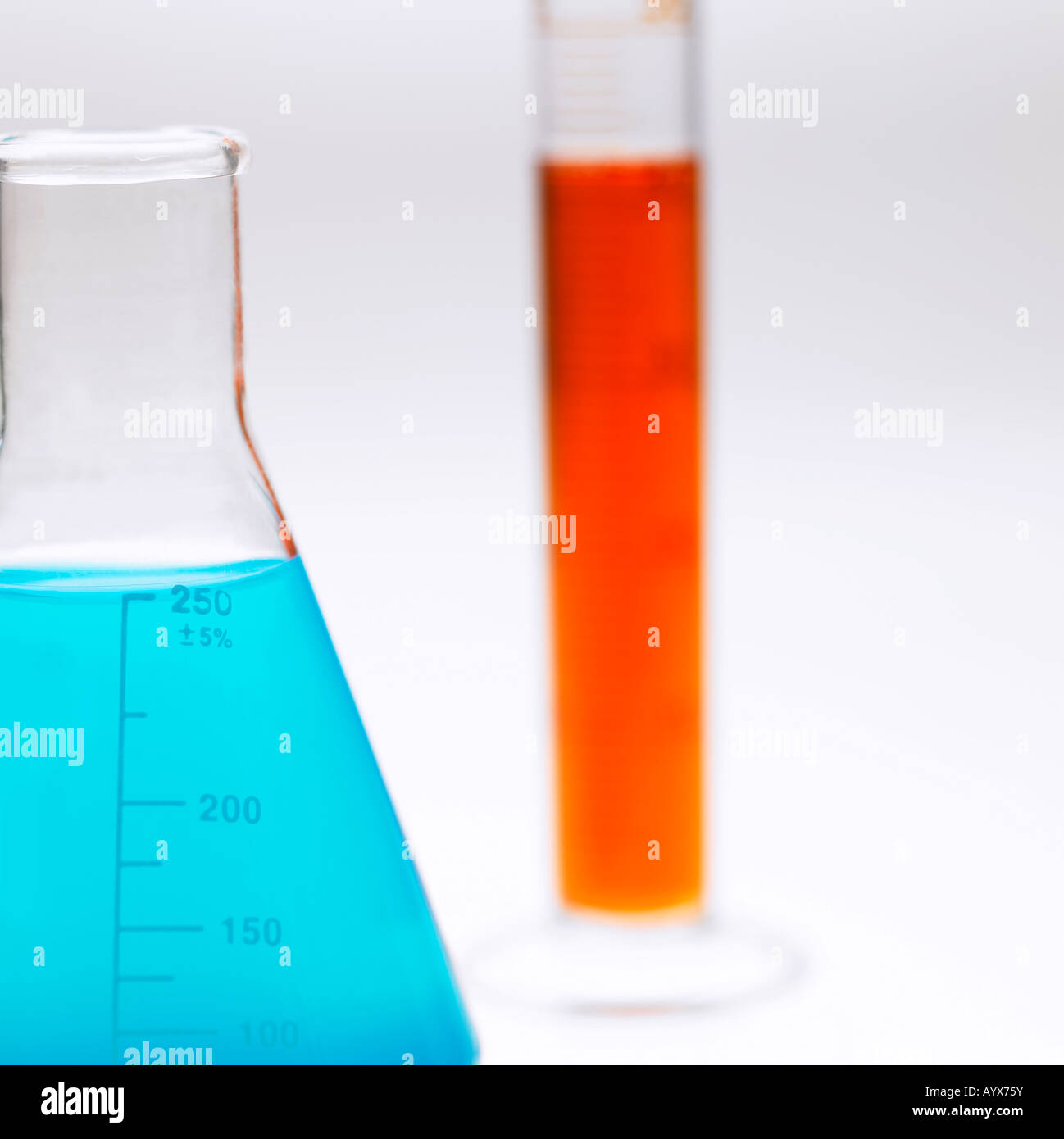triangular flask with blue fluid Stock Photo - Alamy