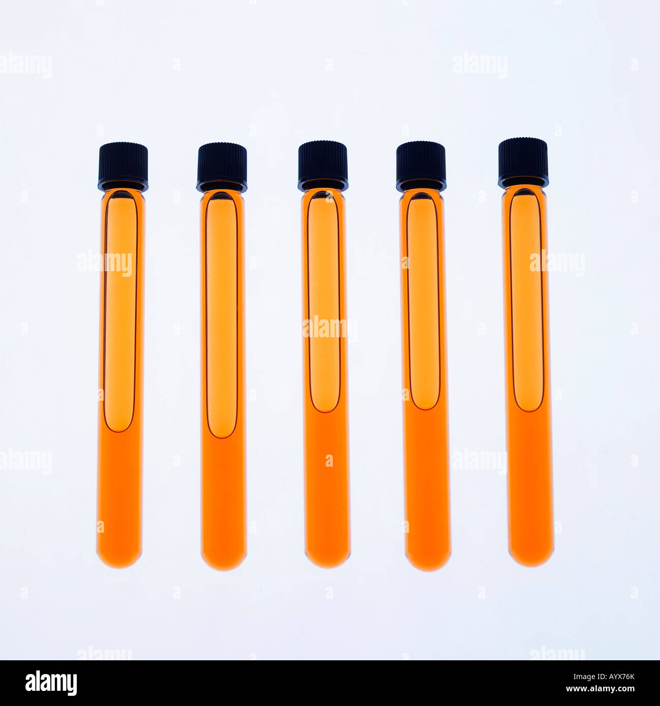 flask with orange color fluid Stock Photo - Alamy