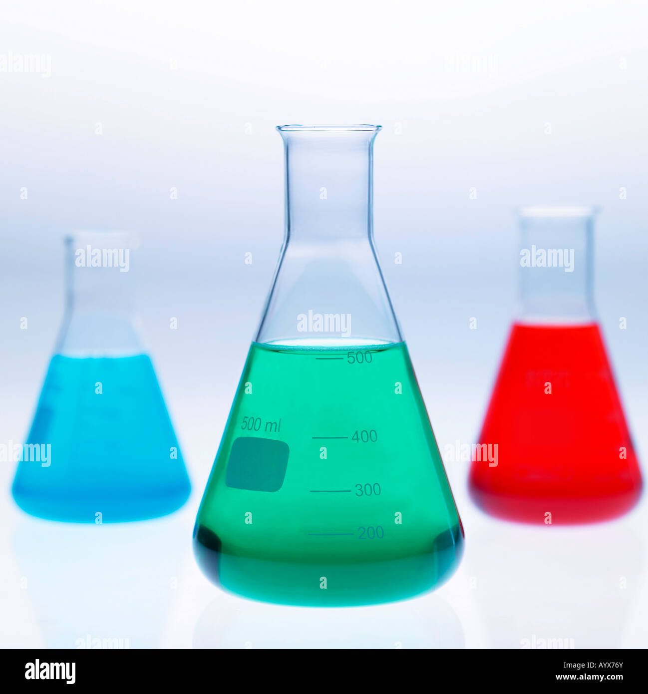 triangular flask with various color fluid Stock Photo - Alamy