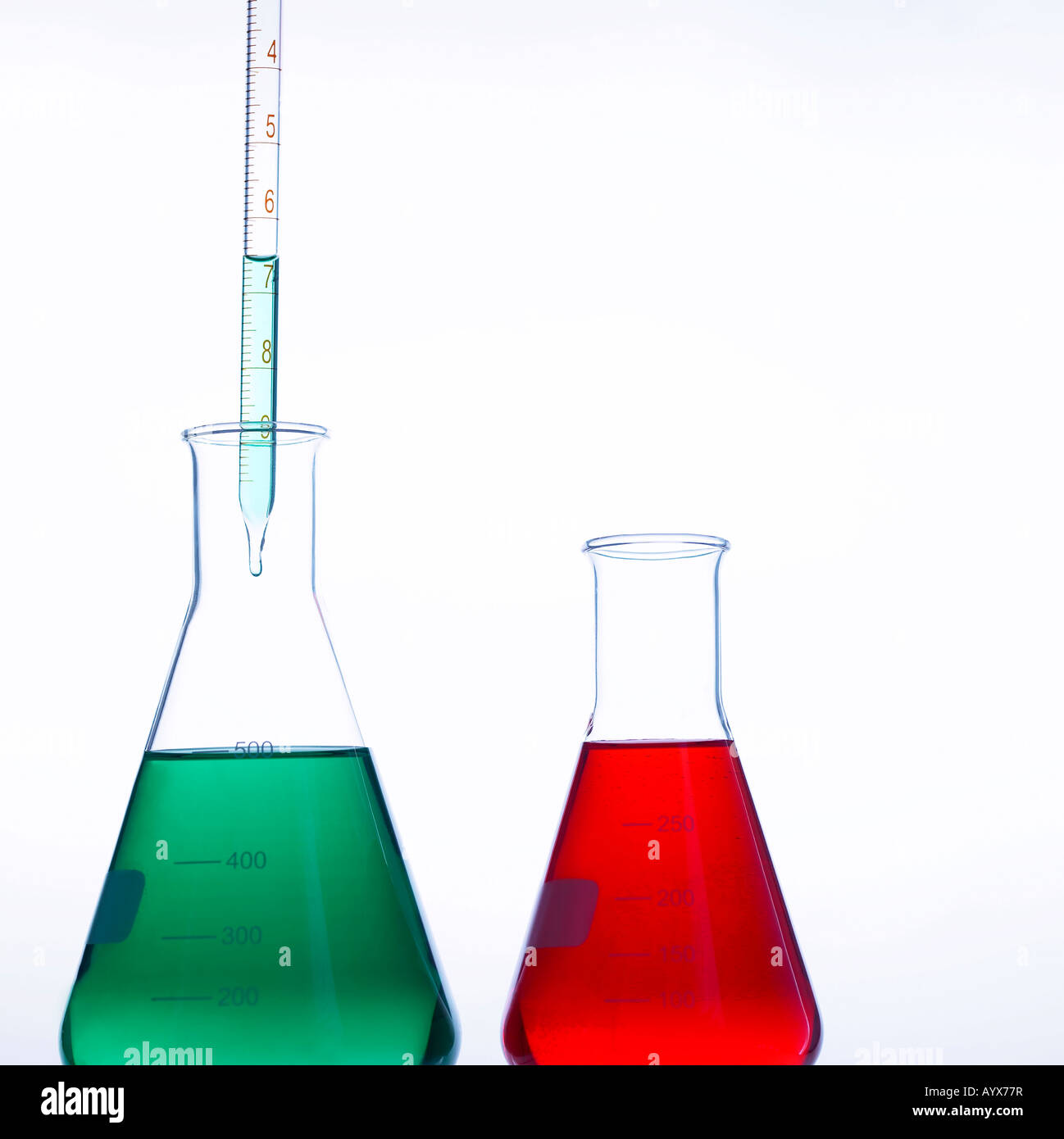triangular falsk with green and red fluid Stock Photo - Alamy