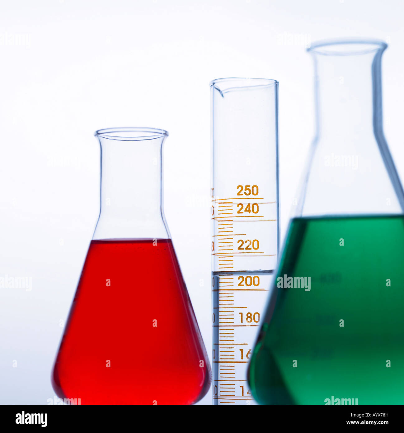 triangular flask with red and green fluid Stock Photo - Alamy