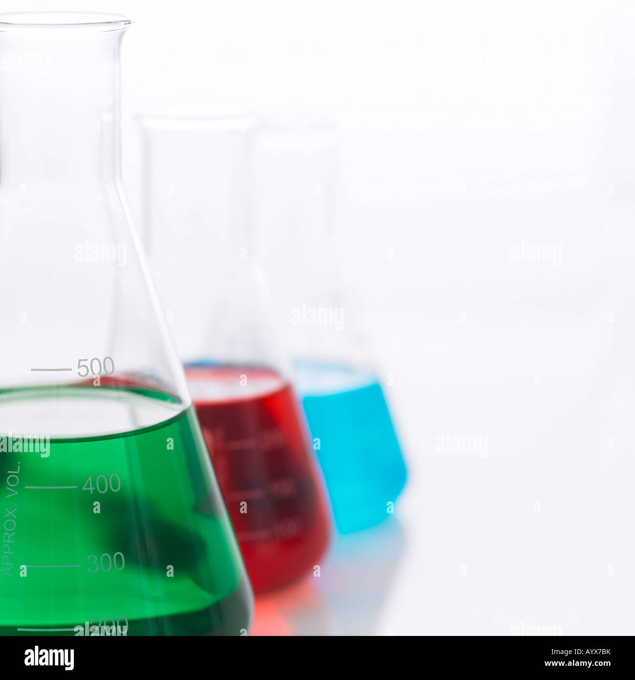 triangular flask with various color of fluid Stock Photo - Alamy