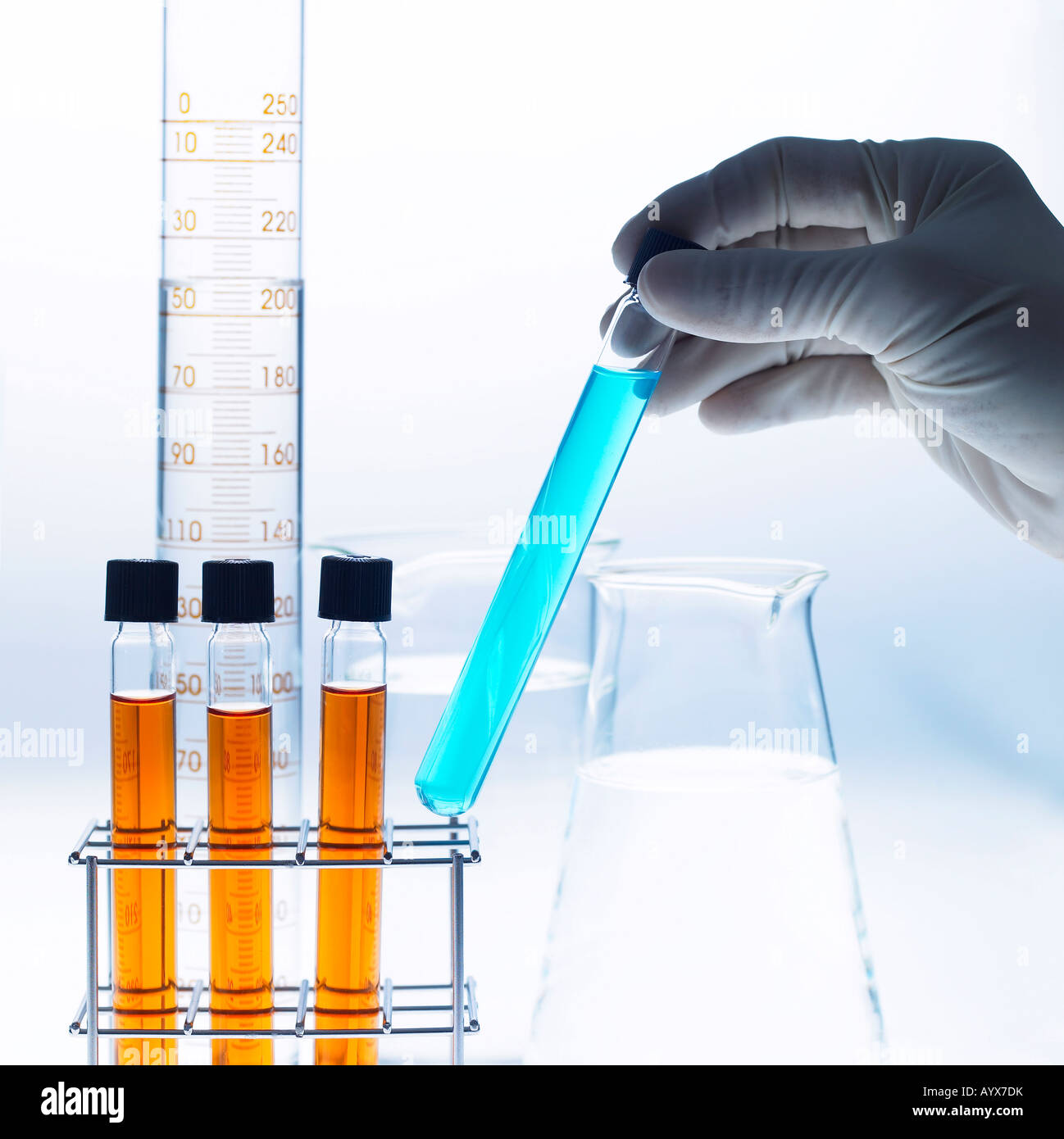 blue test tube in the orange test tube Stock Photo - Alamy