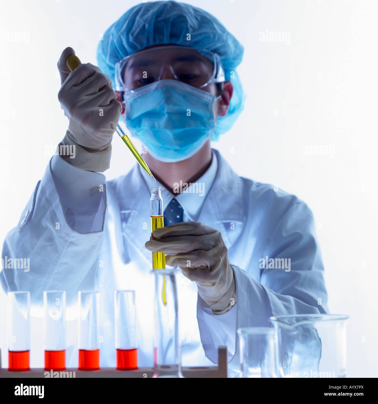 man doing experiment with various fluid Stock Photo - Alamy