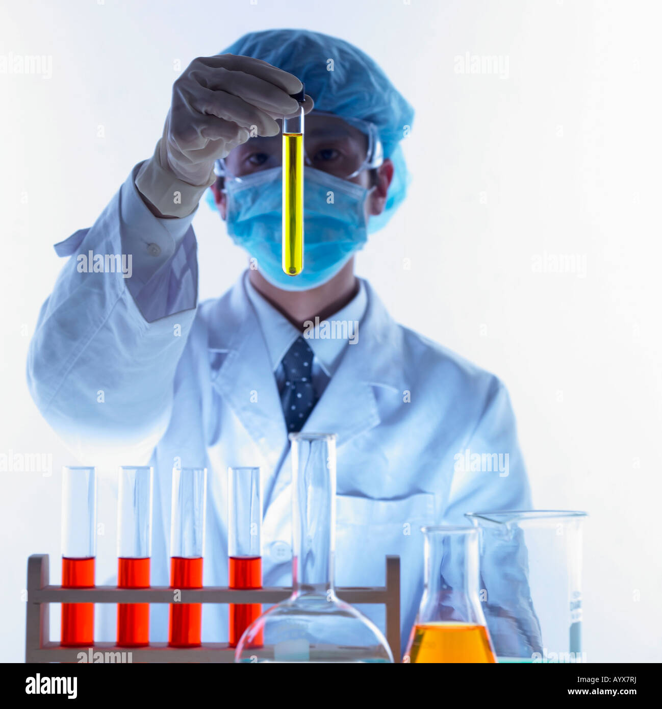 man doing experiment with various fluid Stock Photo - Alamy