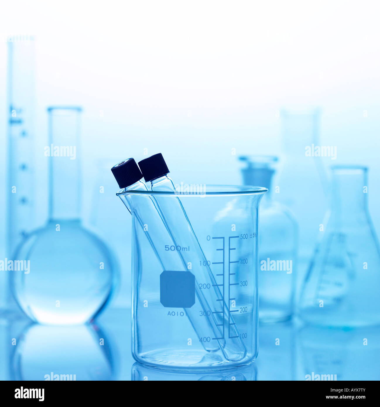 test tube in the beaker with blue background Stock Photo - Alamy