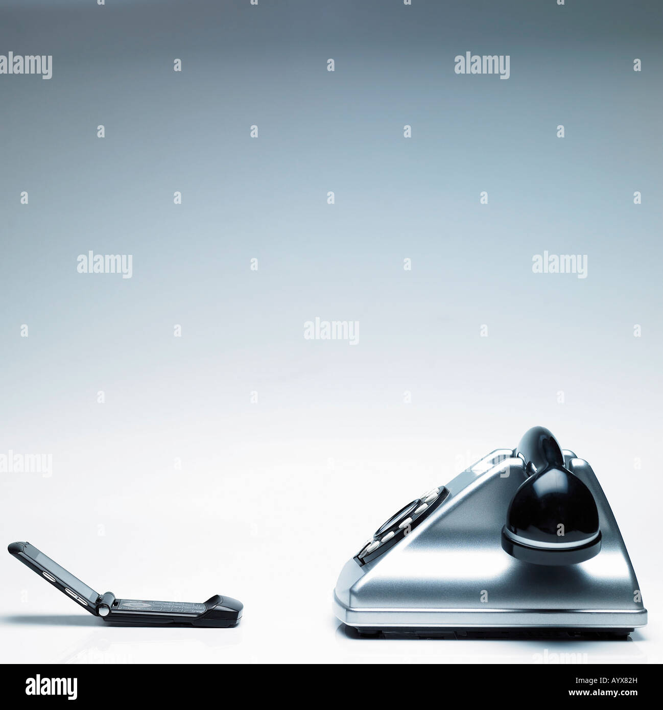 celluar phone and telephone facing each other Stock Photo - Alamy