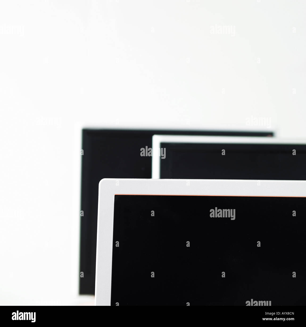 arrayed monitors on white background Stock Photo - Alamy